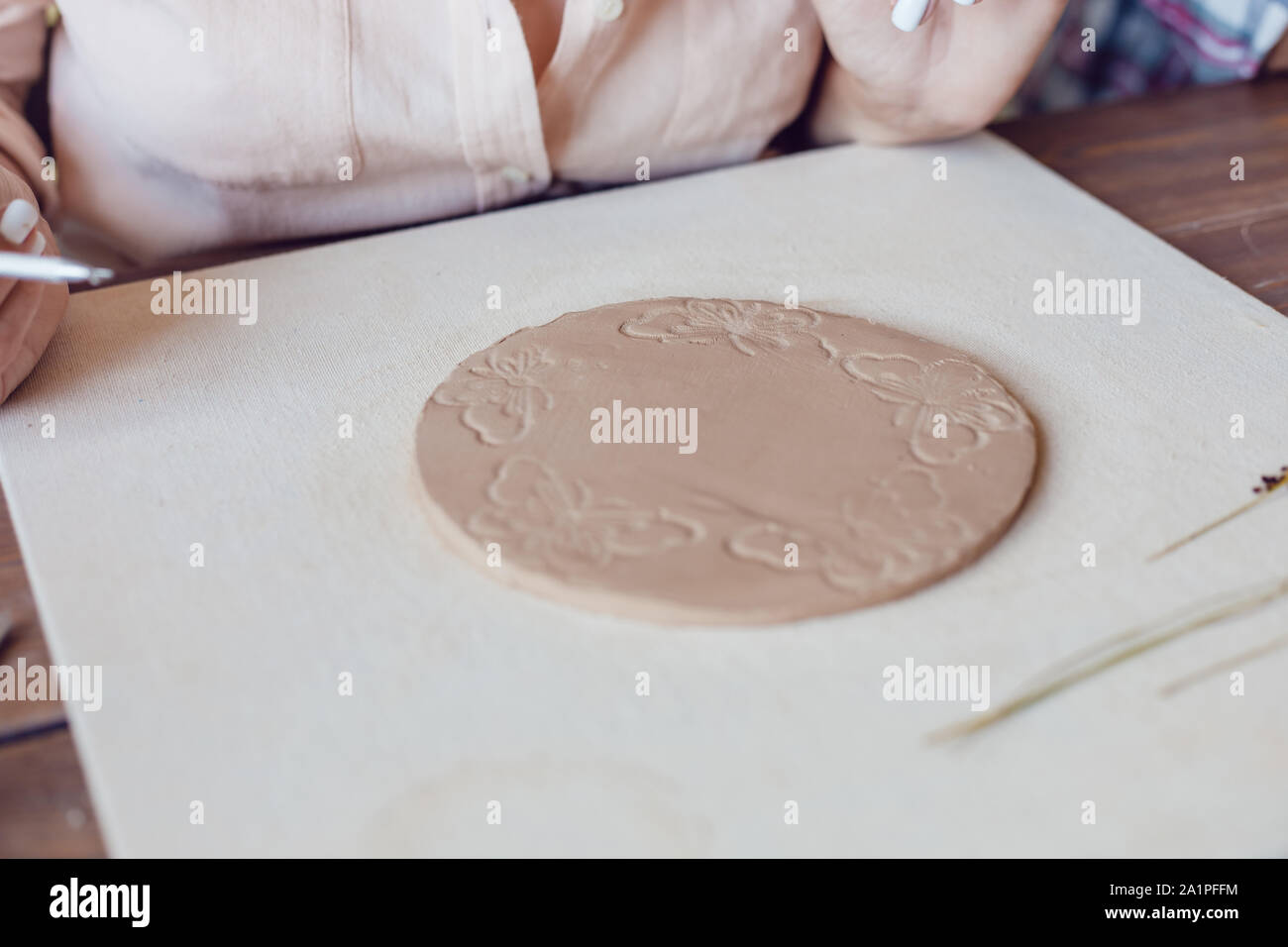 Round painted clay stand Stock Photo - Alamy