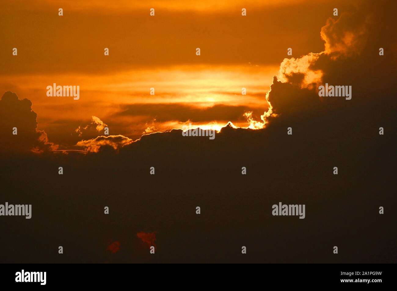 Sunset with Red sun and Clouds afternoon view of the sky Stock Photo ...