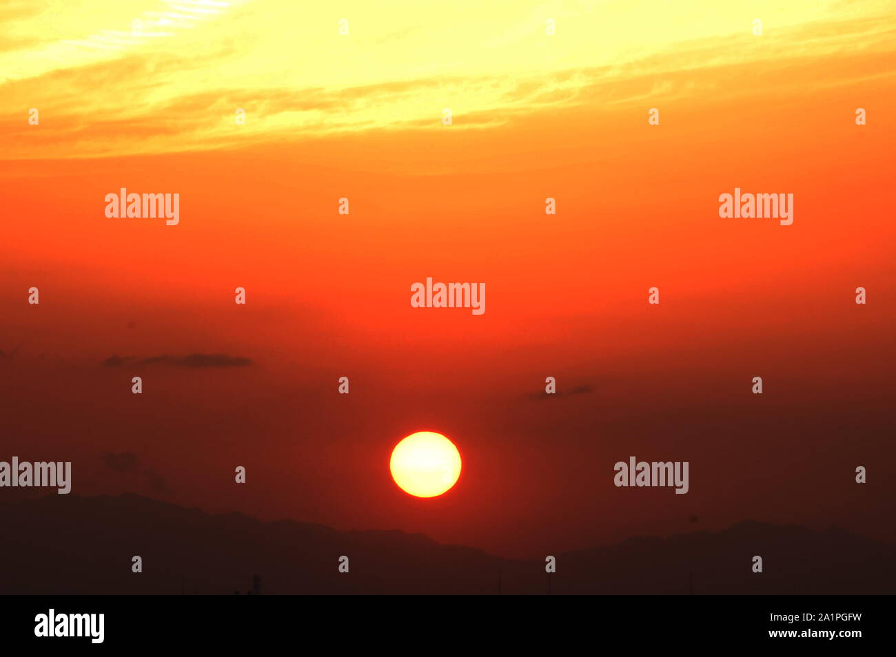 Sunset with Red sun and Clouds afternoon view of the sky Stock Photo ...