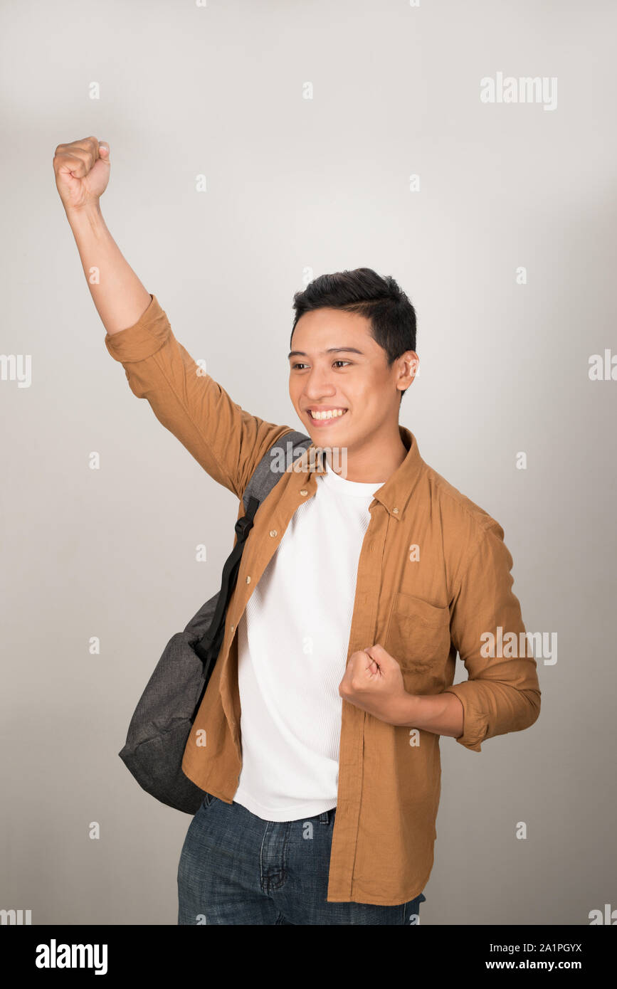 Young student man celebrating victory and success very excited ...