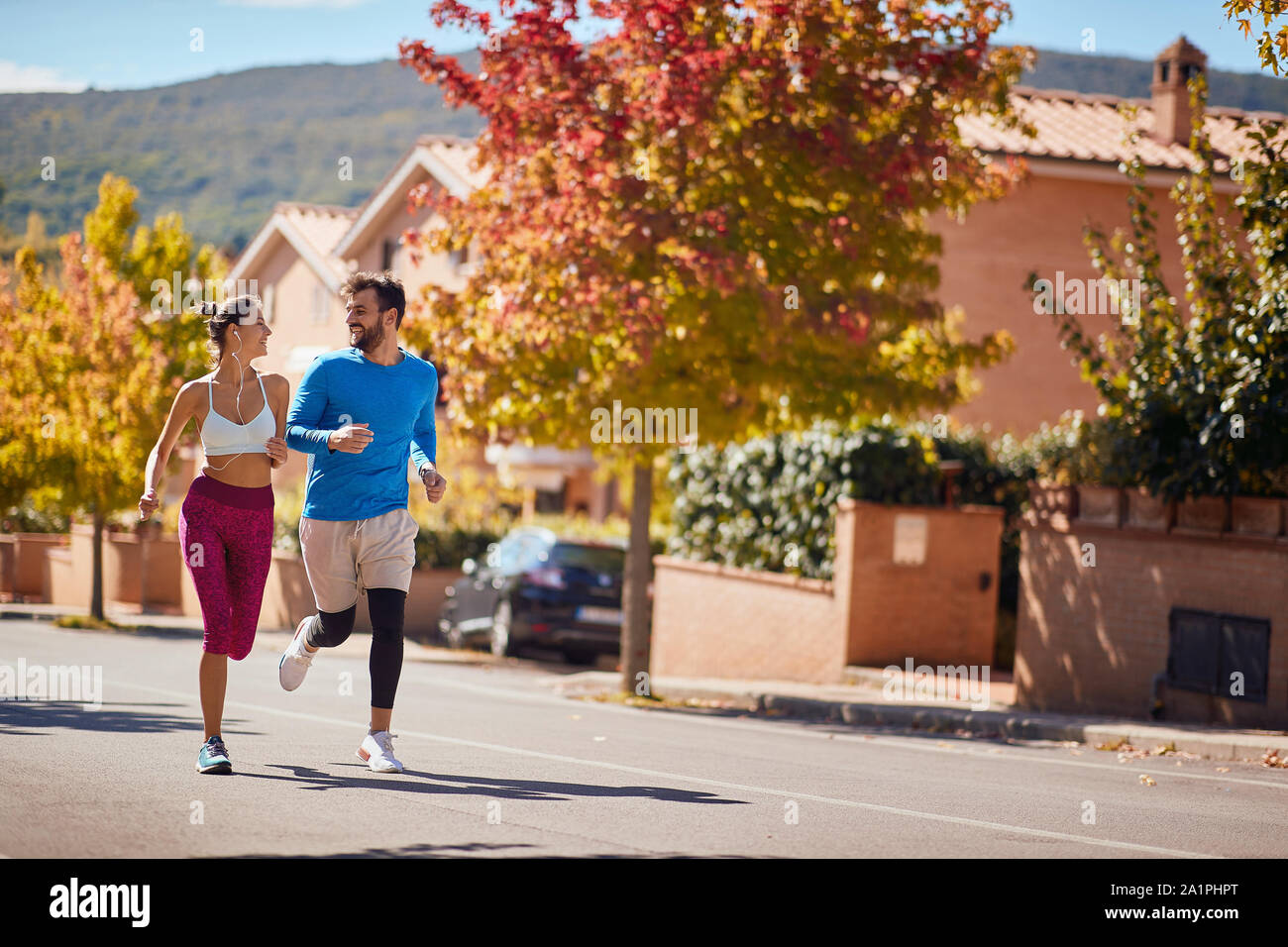 Young smiling couple jogging. running at city. healthy lifestyle Stock ...
