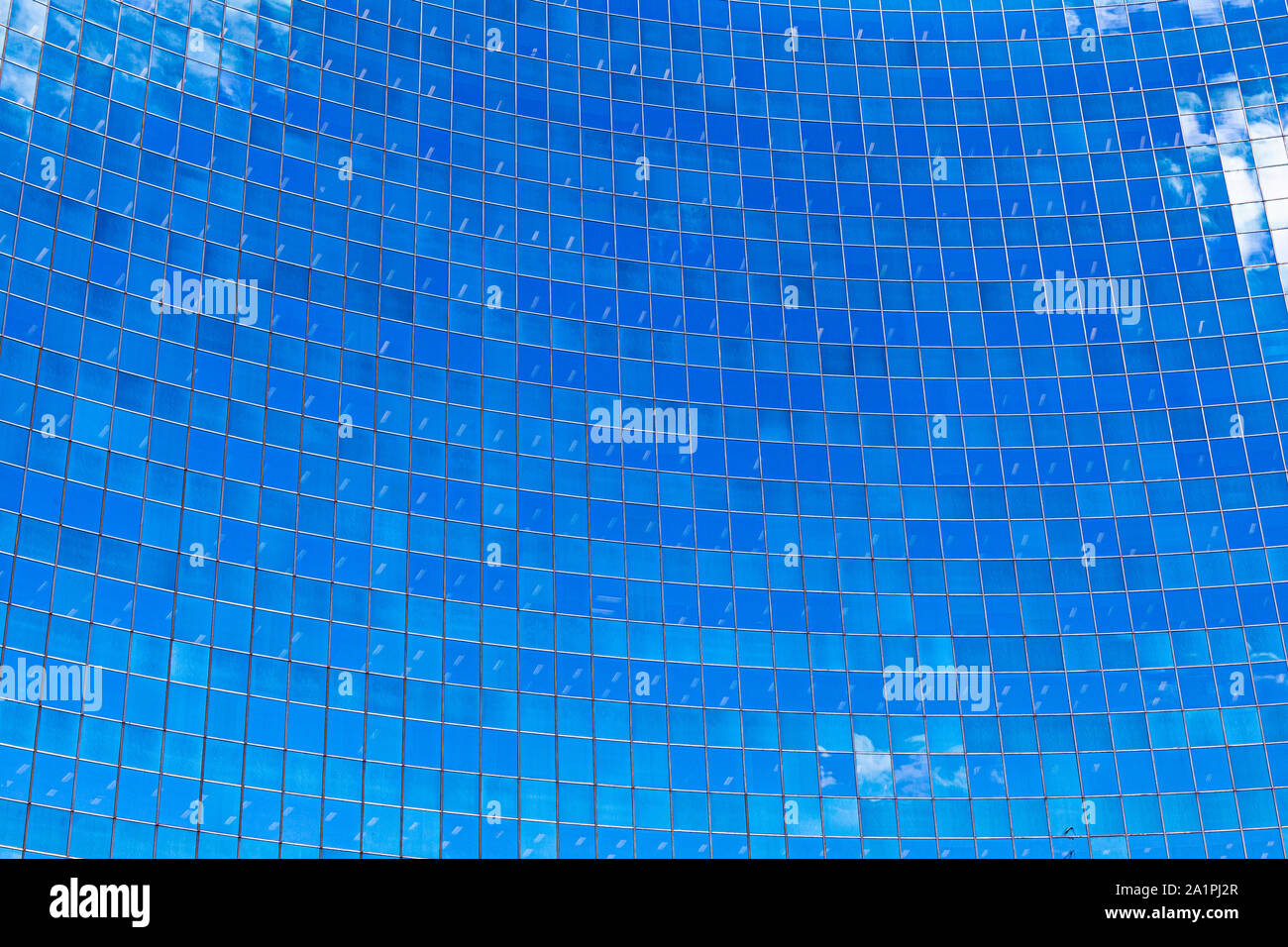 A large building with blue windows Stock Photo - Alamy