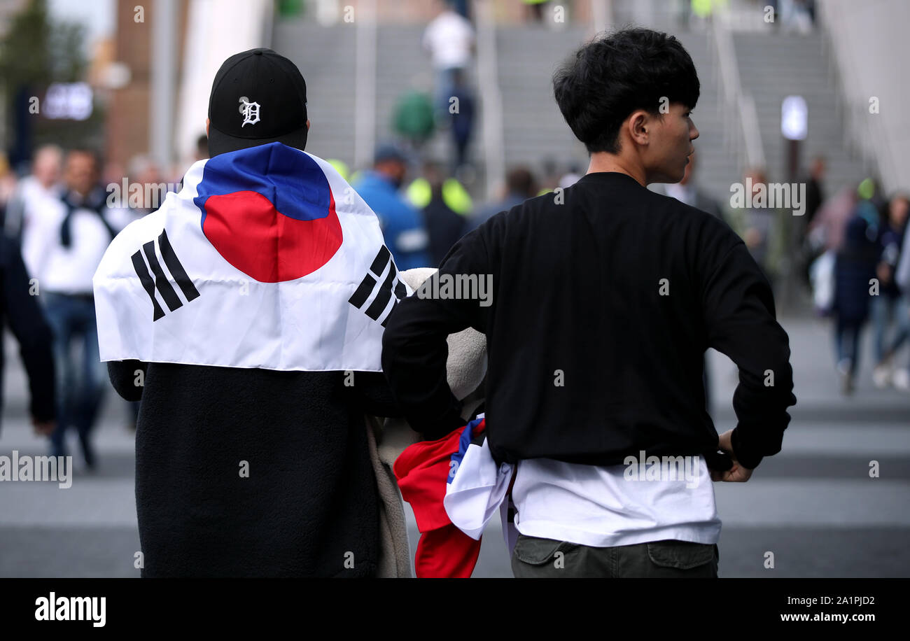 Tottenham Hotspur fans with a South Korean flag arrive for the Premier ...