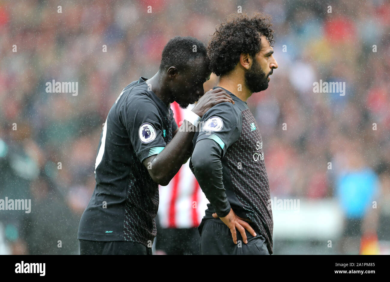 Liverpool's Sadio Mane and Liverpool's Mohamed Salah in the rain during ...