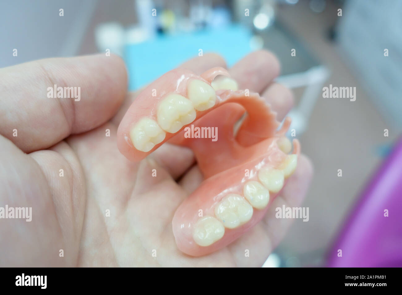 removable denture in the hands of a doctor in a dental office Stock ...