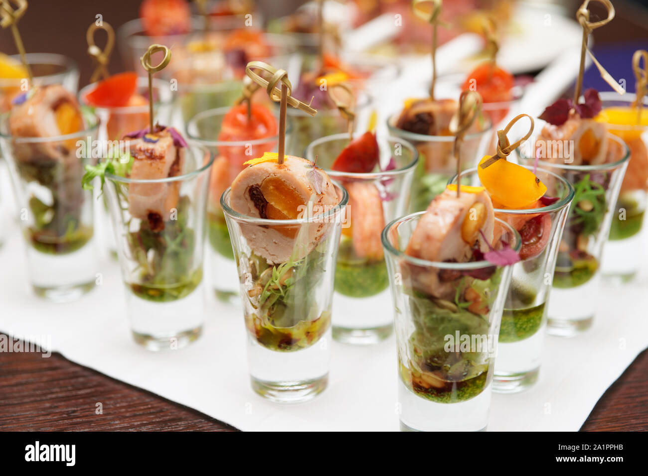 Various snacks in shot glasses, close-up Stock Photo - Alamy
