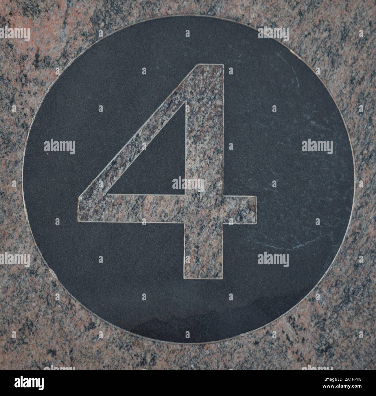 Number 4 four in pink marble inside a circle of black marble, pink ...