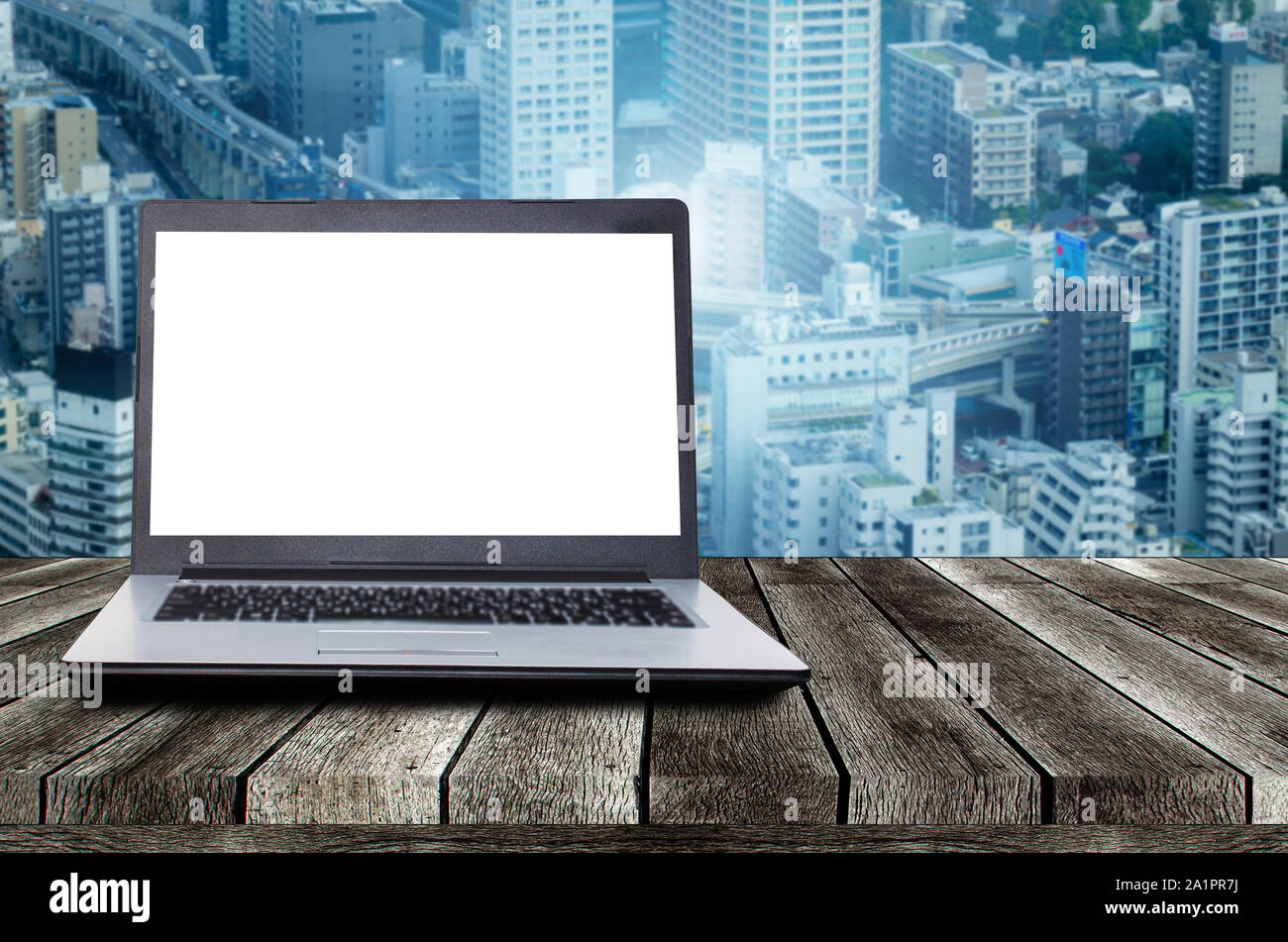 laptop notebook computer with white blank space screen on wooden desk ...