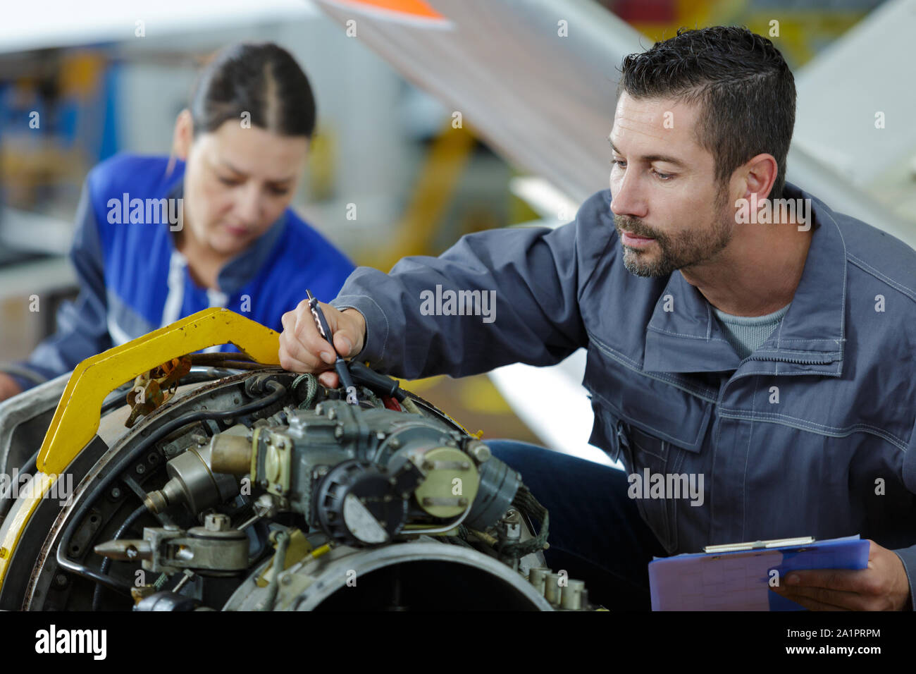 apprentice studying car engines with a mechanic Stock Photo - Alamy