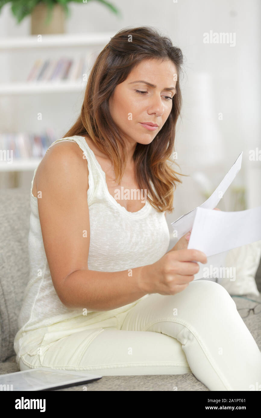 a woman checking expensive bills Stock Photo - Alamy