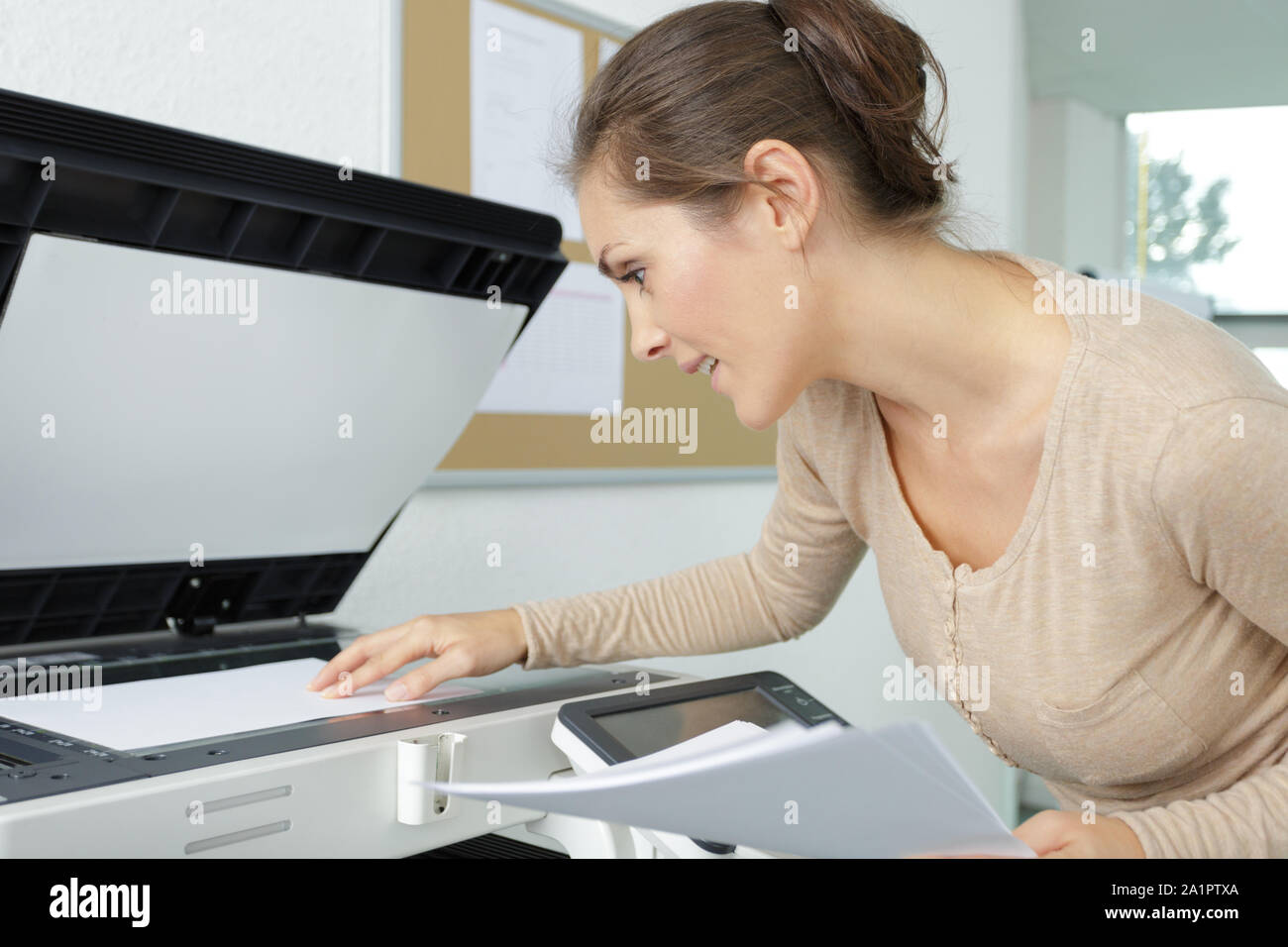 female worker using photocopy machine Stock Photo - Alamy