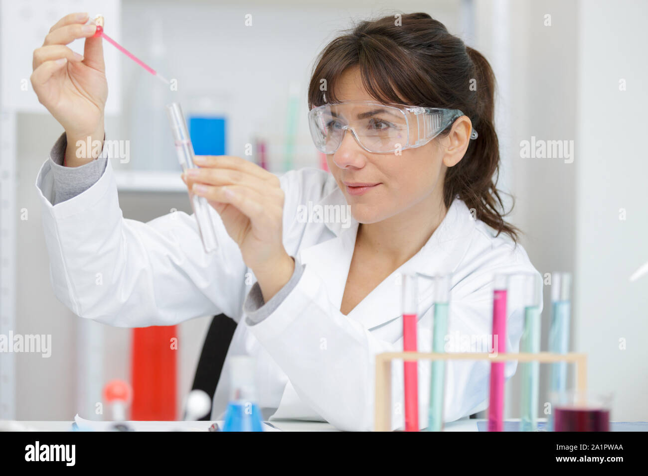 Close up researcher adding liquid hi-res stock photography and images ...