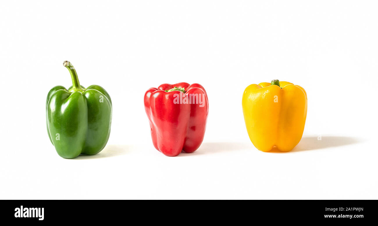 Green, red and yellow pepperoni isolated on a white background. Still ...