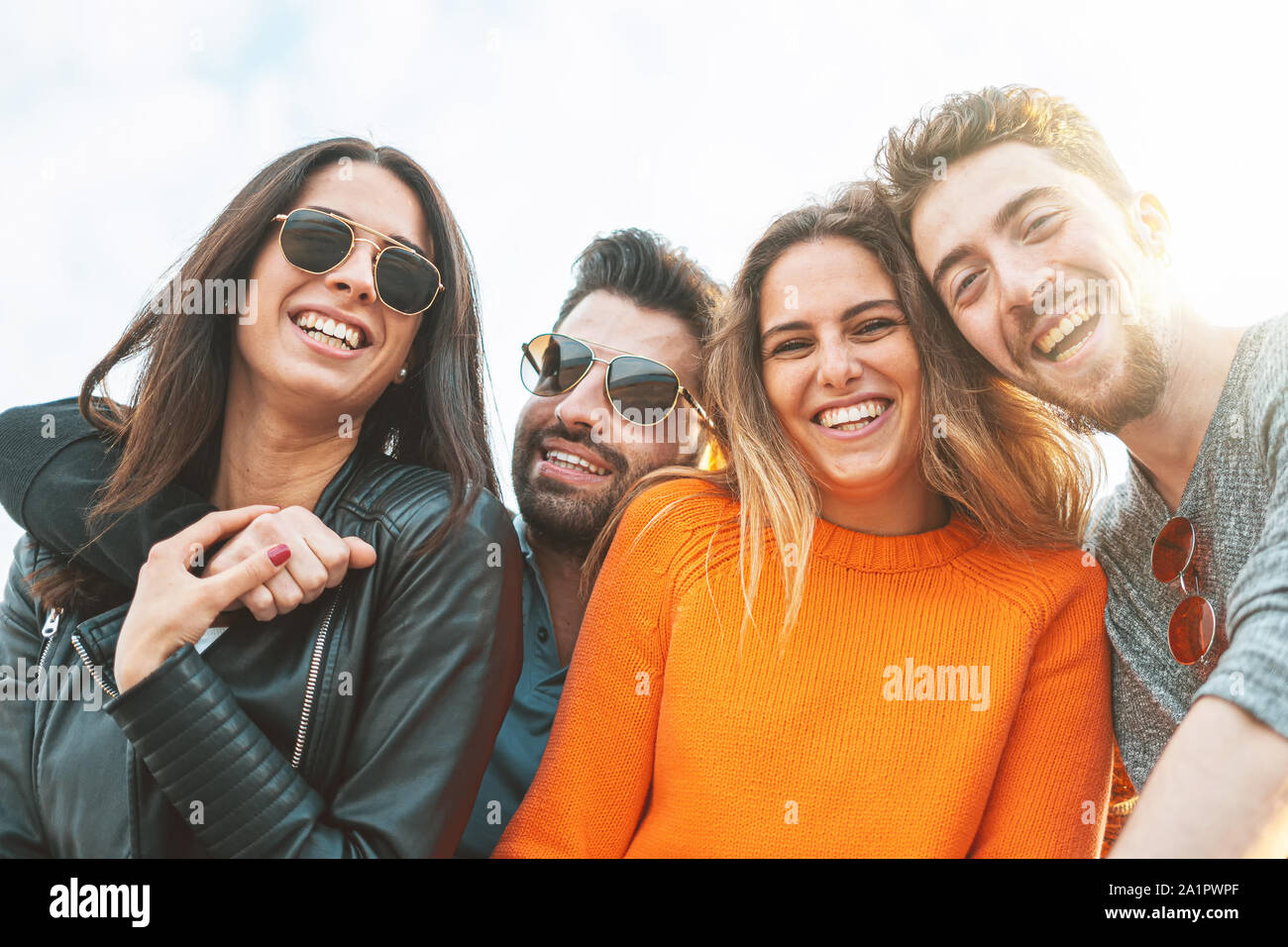 Portrait of 20s young friends having fun together and watching the ...