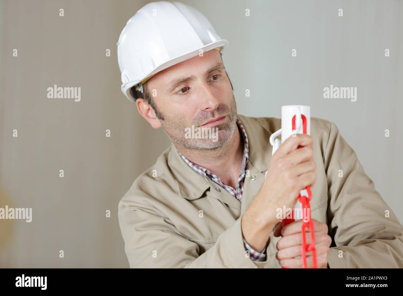 smart concentrated builder in construction site Stock Photo - Alamy