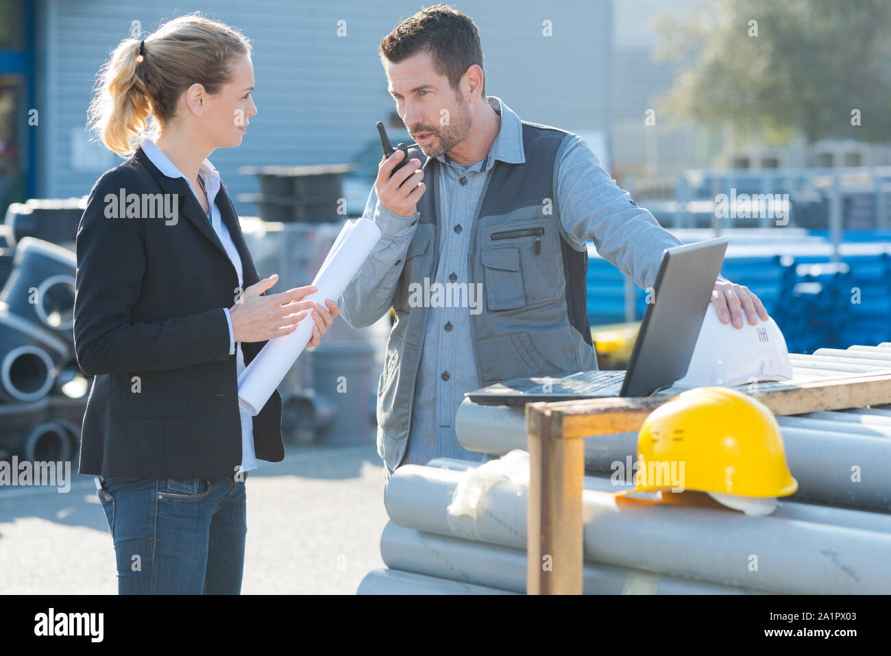 steel pipe production worker and engineer Stock Photo - Alamy