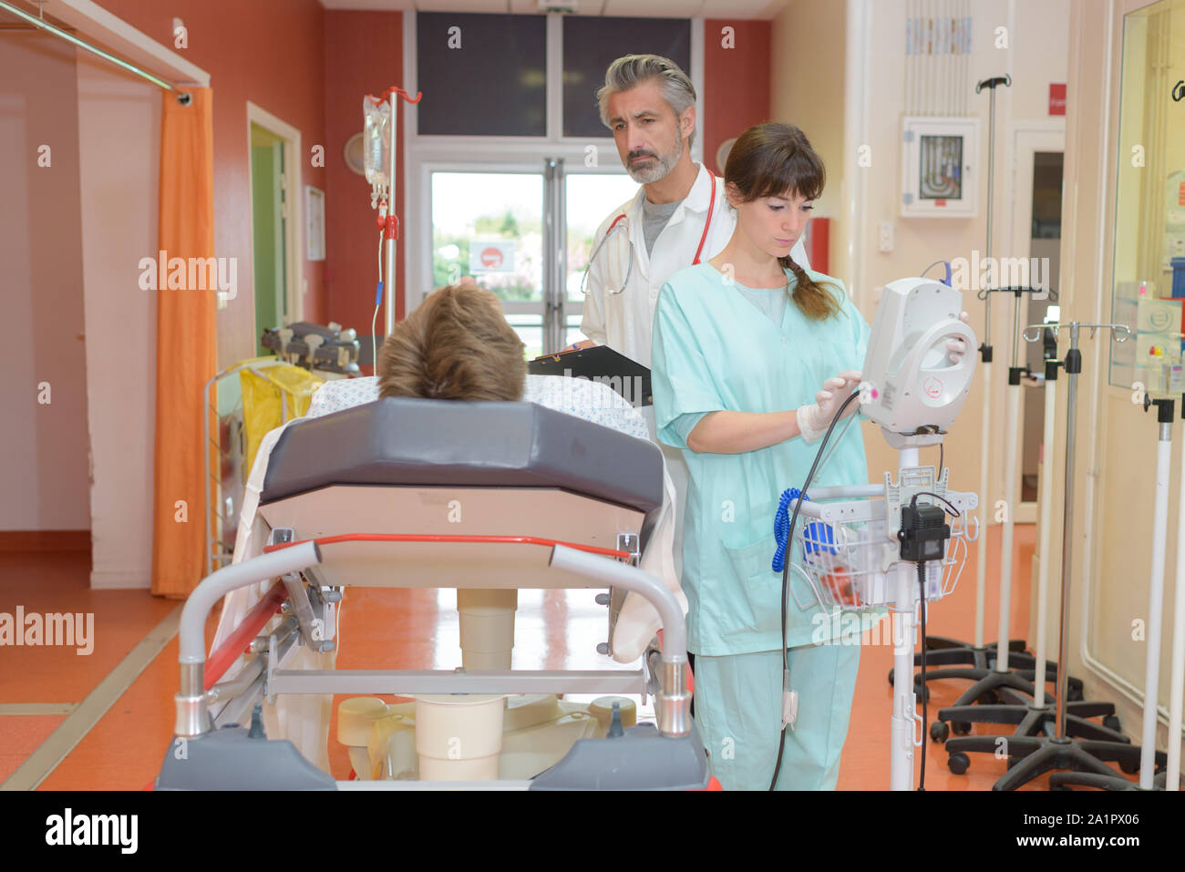 Transferring patient hospital bed hi-res stock photography and images ...