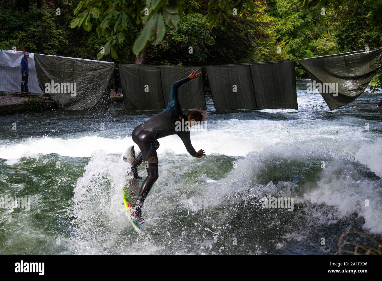 Munich, Germany. 28th Sep, 2019. An iceberg surfer jumps with his ...