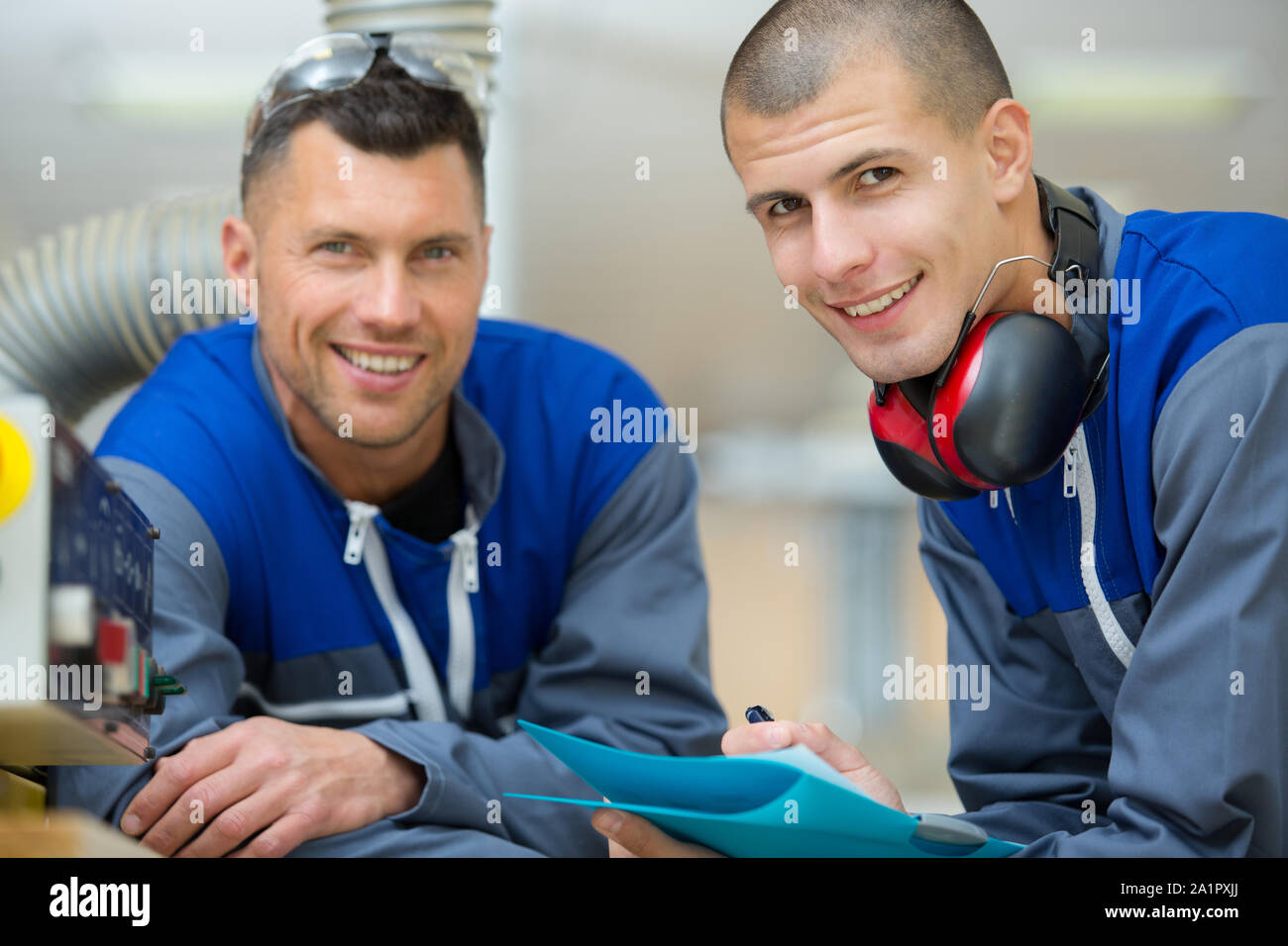 Men in blue uniforms hi-res stock photography and images - Alamy