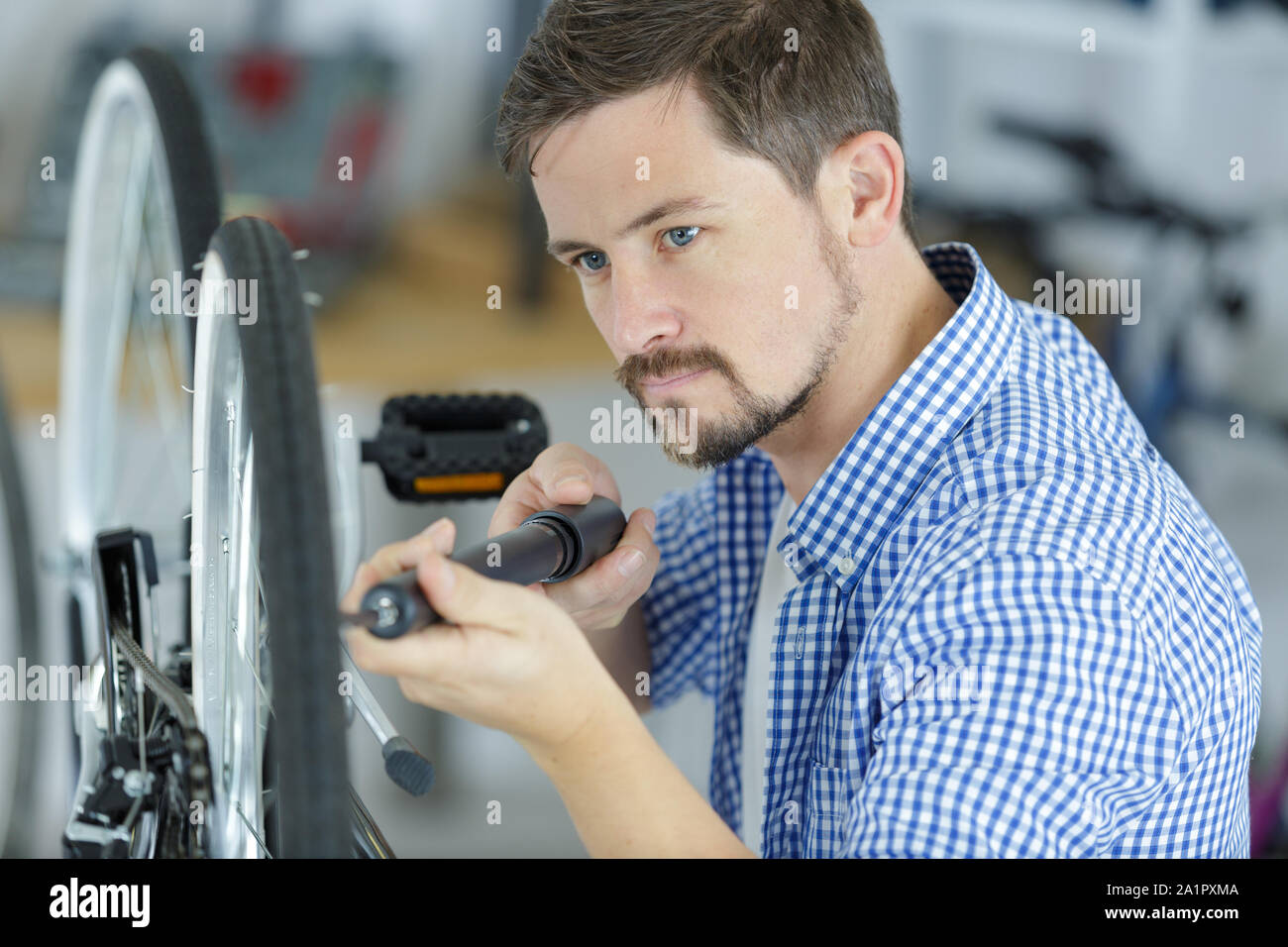 Man using air pump hi-res stock photography and images - Alamy