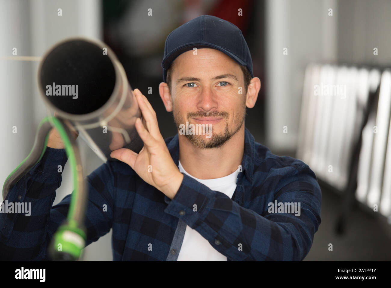 Plumber tightening water pipes hi-res stock photography and images - Alamy