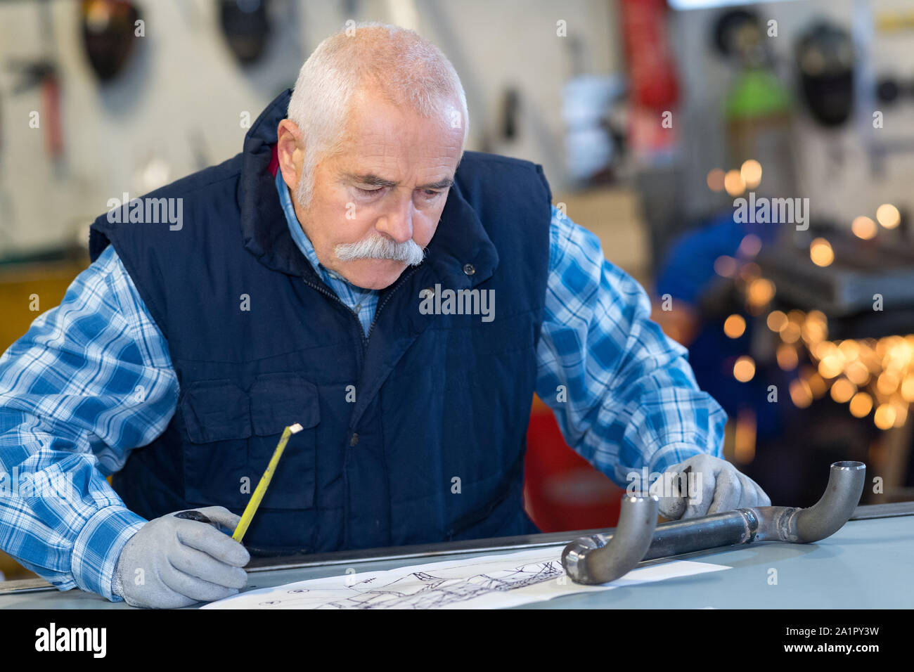 senior architect working on construction blueprint Stock Photo - Alamy