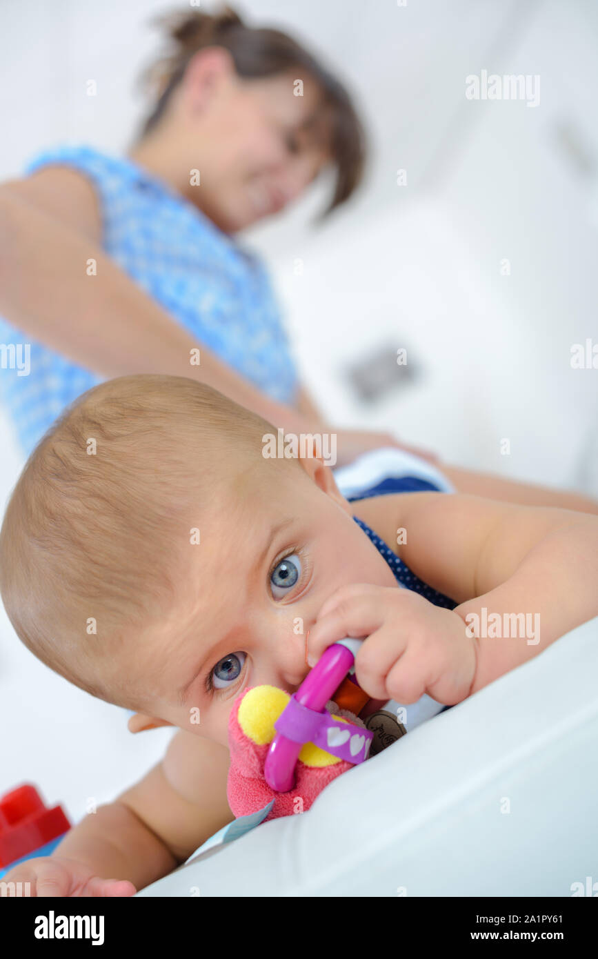 mother and baby with teether Stock Photo - Alamy
