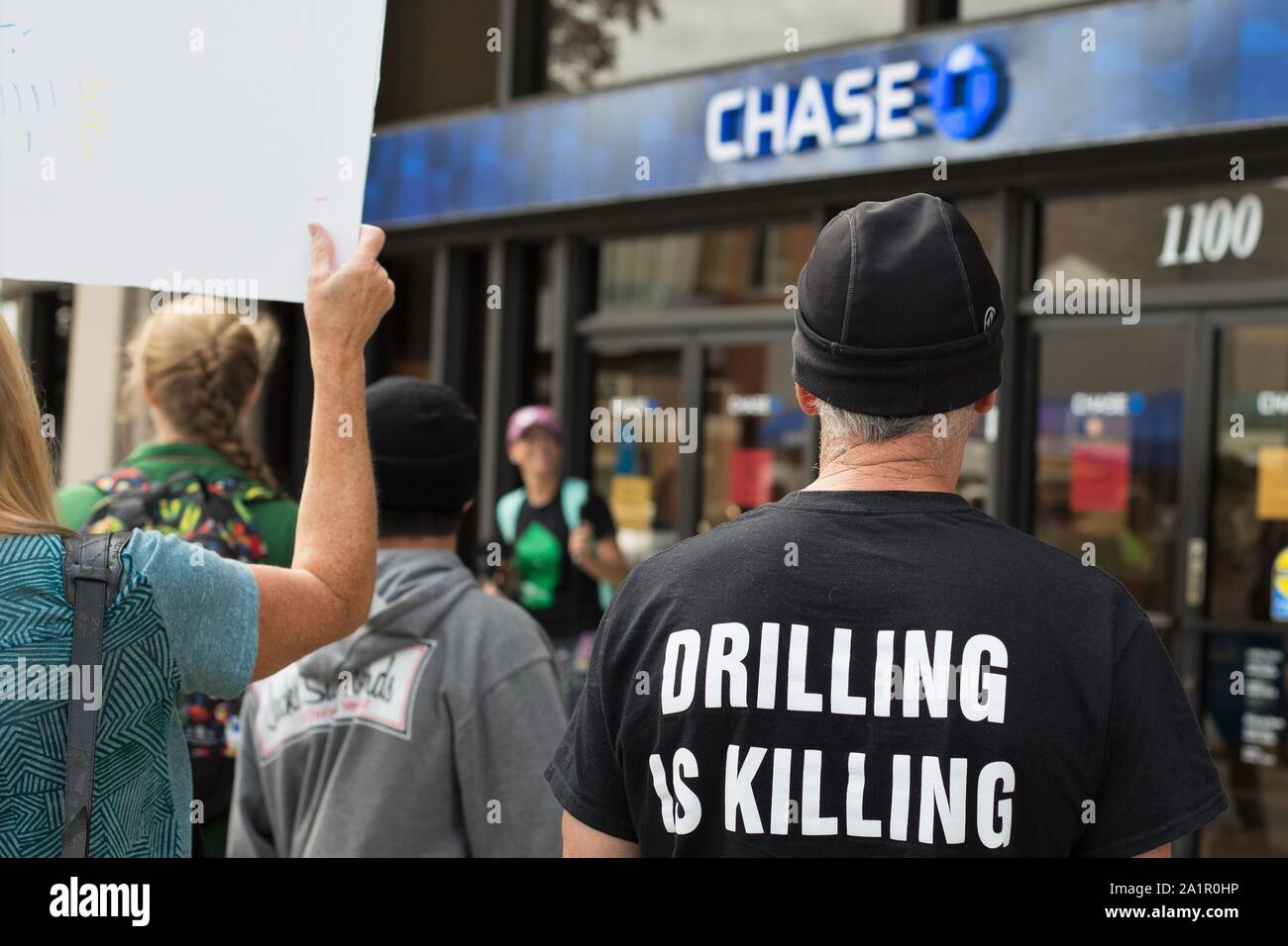 Climate activists perform a die-in at Chase Bank in Eugene, Oregon, USA ...