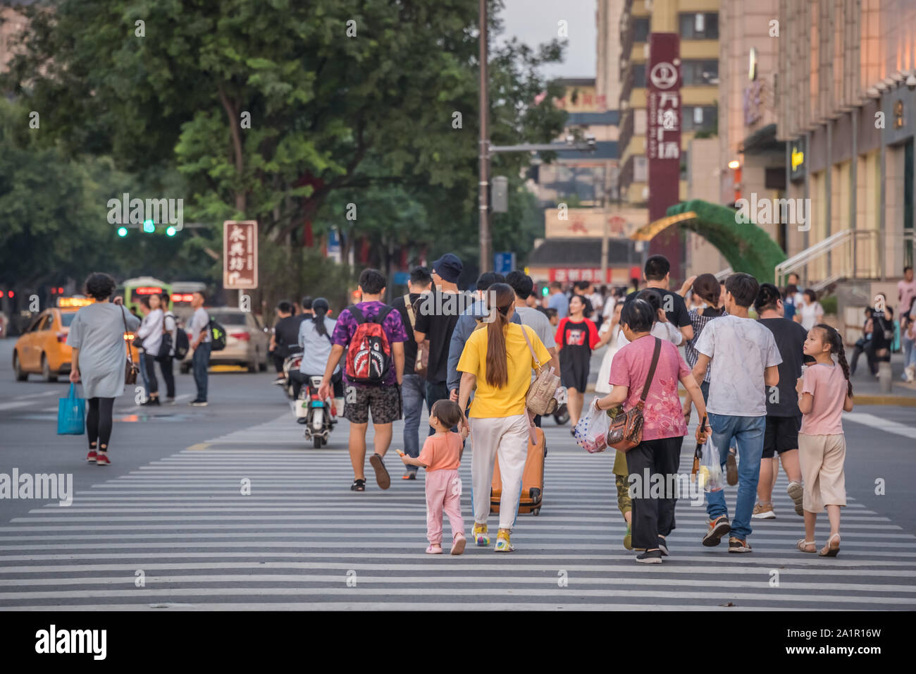 Xian, China - August 2019 : People on a zebra crossing in the city of ...