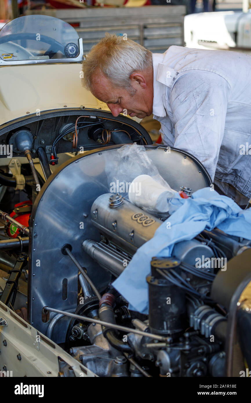Mechanic at work on a 1935 ERA B-Type R7B in the paddock at the 2019 ...