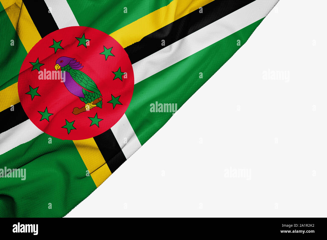Dominica flag of fabric with copyspace for your text on white ...