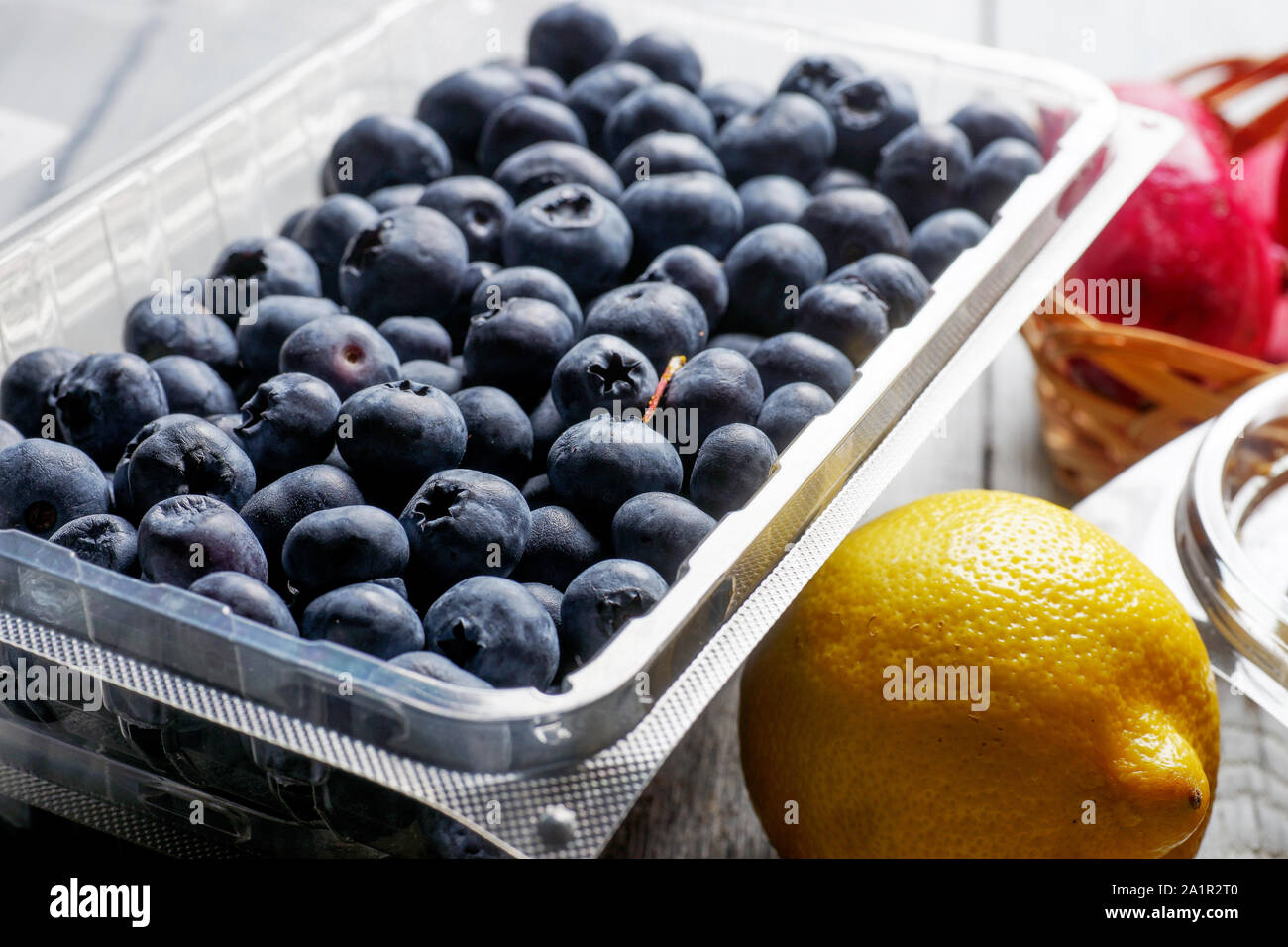 Blueberries in white colander hi-res stock photography and images - Alamy