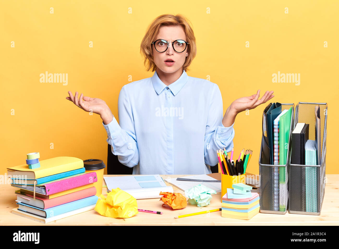 puzzled woman with raised arms expressing her indifference, close up ...