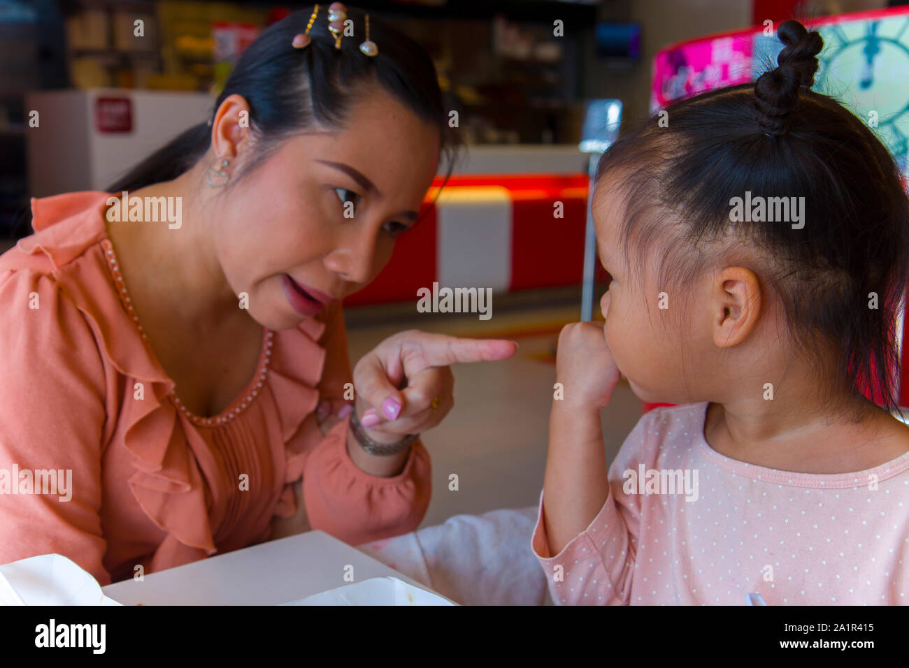 Angry mom with her child, looking her daughter and complaining. High ...