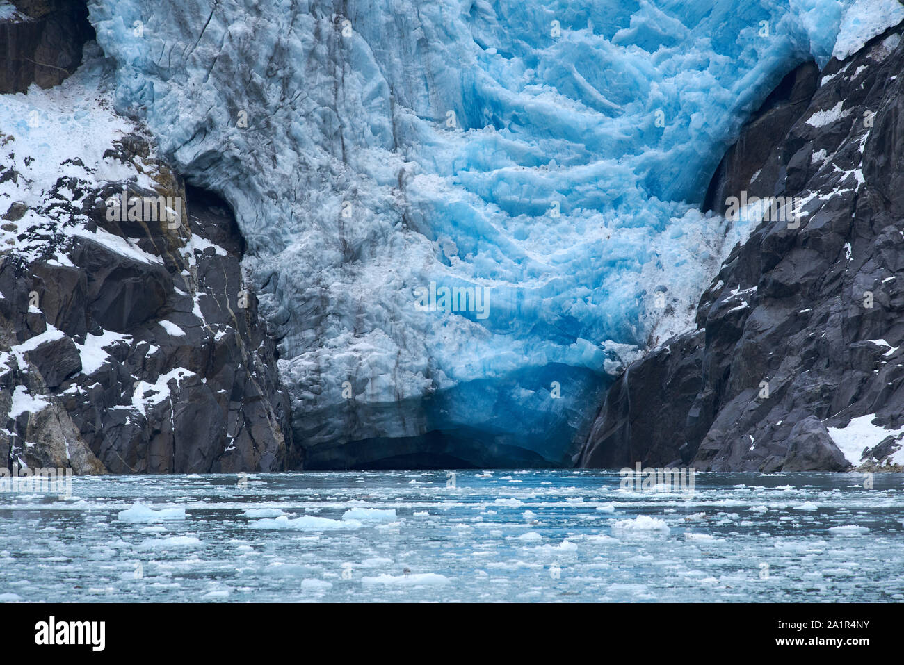 The vertically sloped, two-toned glacier tongue of Northwestern Glacier ...