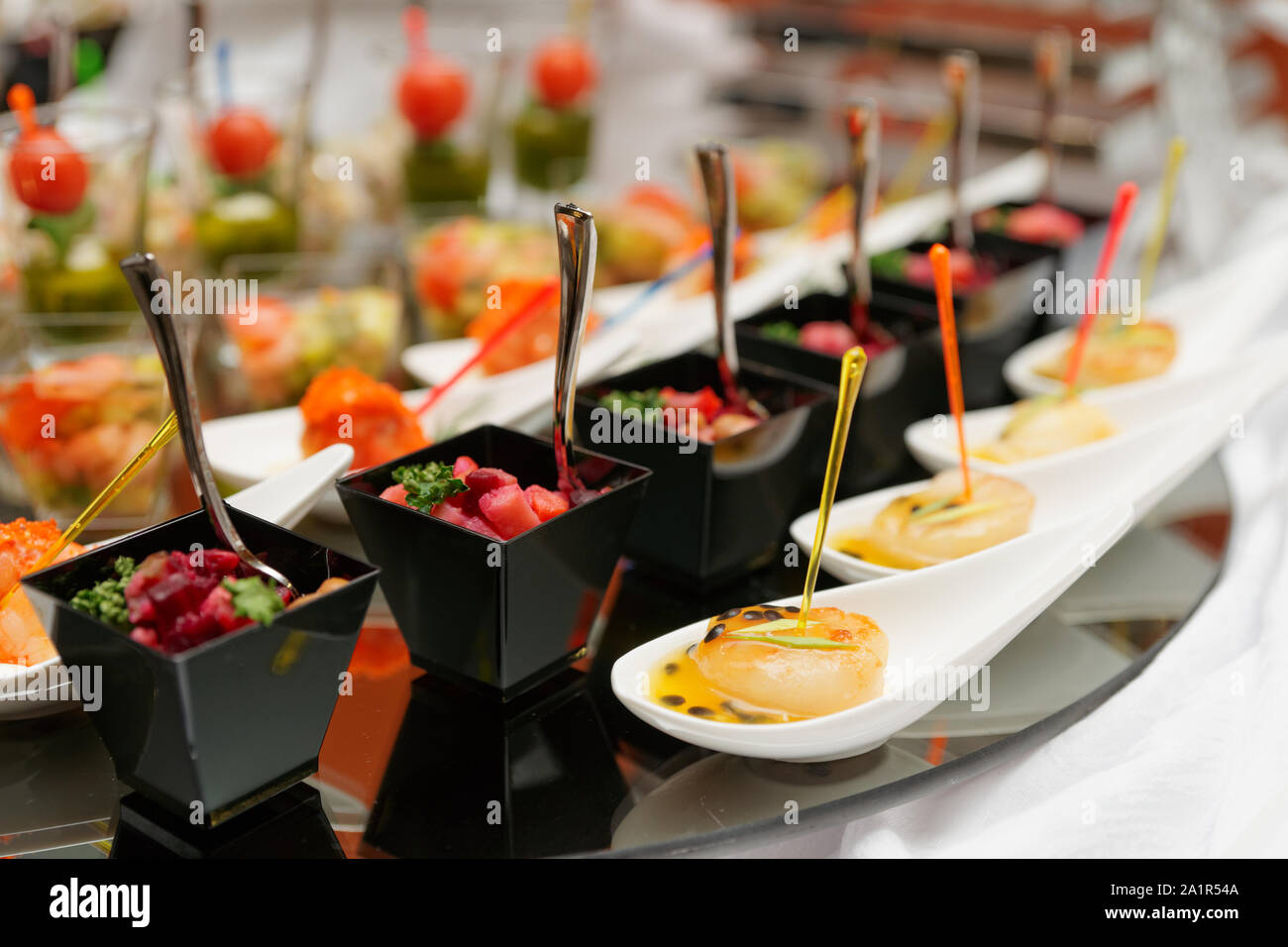 Various snacks on table, banquet food Stock Photo - Alamy