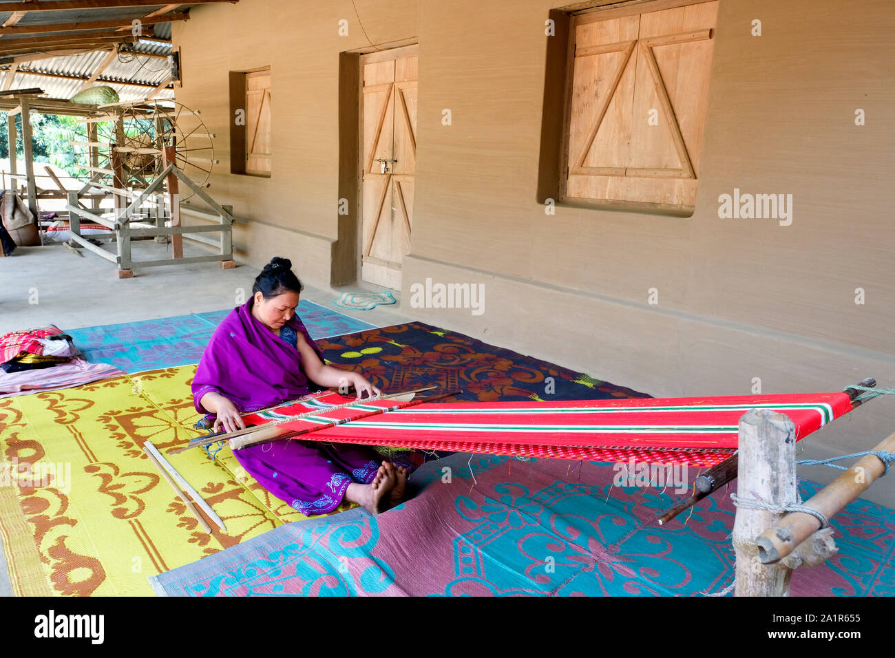 Woman weaving with her hand loom. Village of Borakathal, Tripura State ...