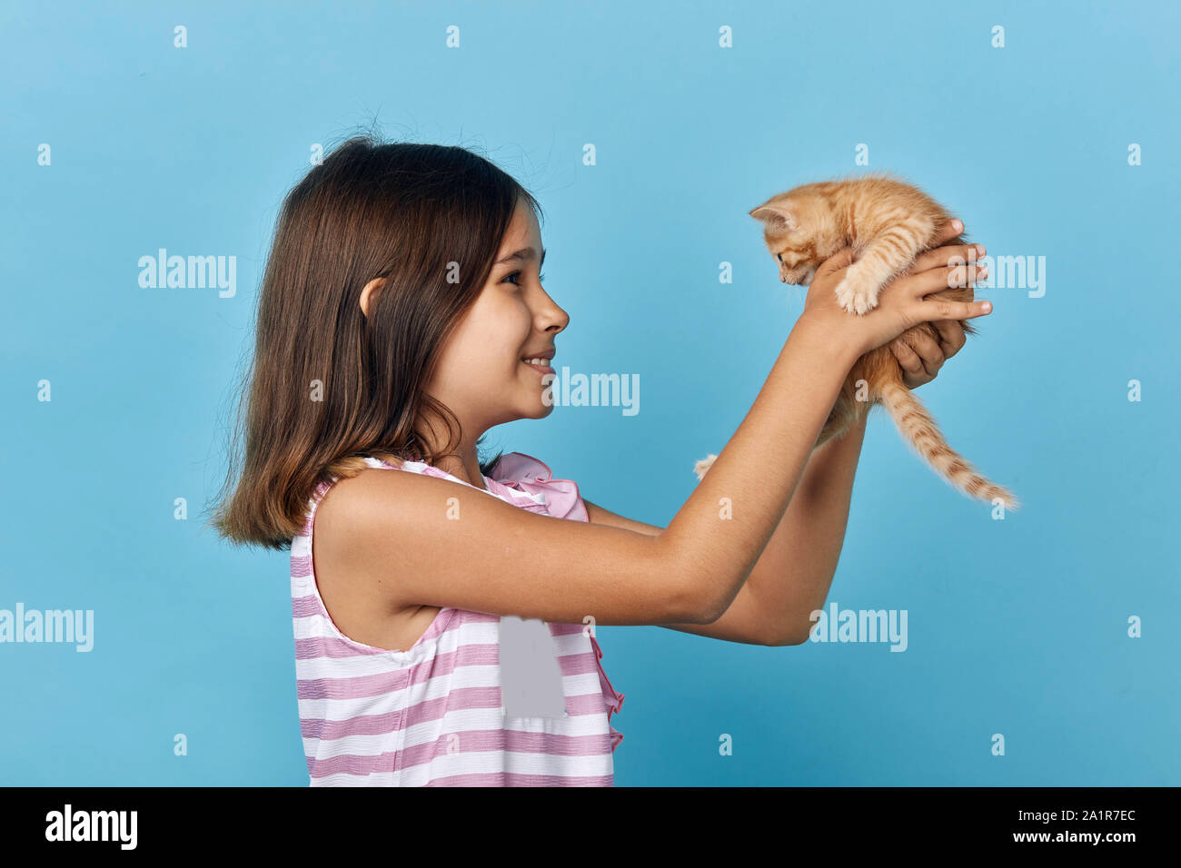 friendly kind girl having fun, happy childhood . close up side view ...