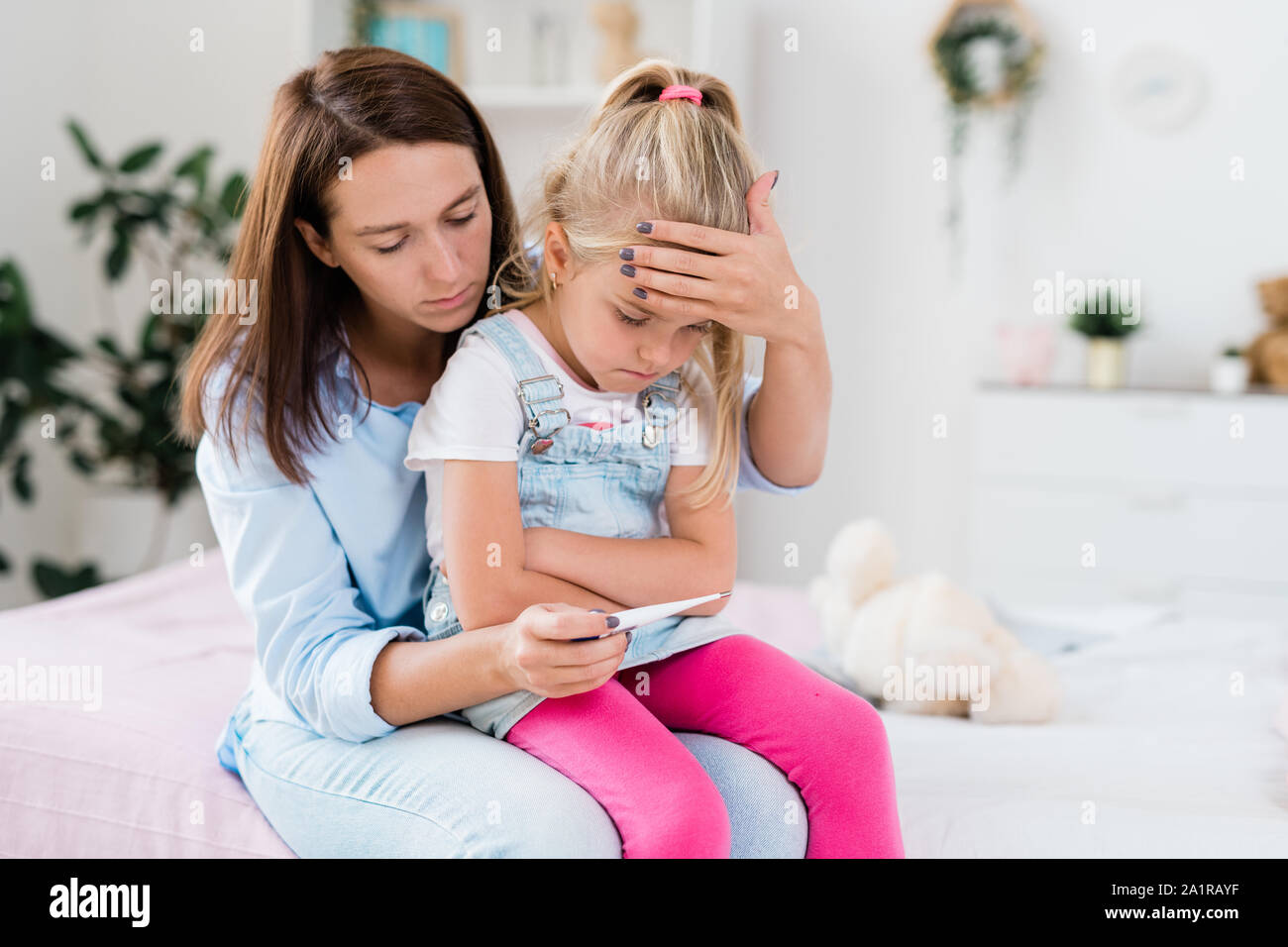 Two women touching forehead hi-res stock photography and images - Alamy