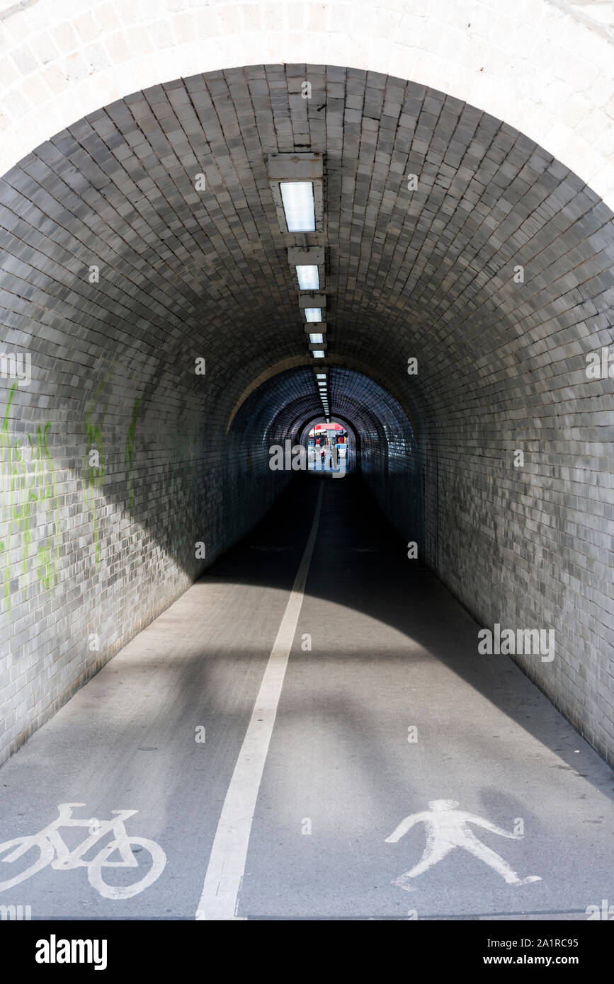 White brick Leeman Road tunnel underpass marked on ground for ...