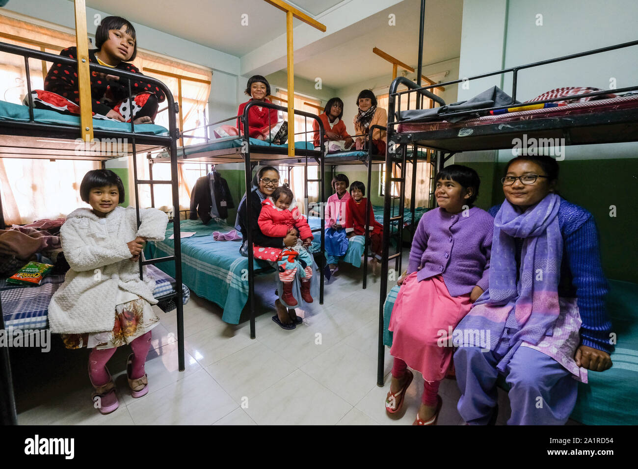 Children are sitting on their beds in the dorm in the "Ferrando Transit ...