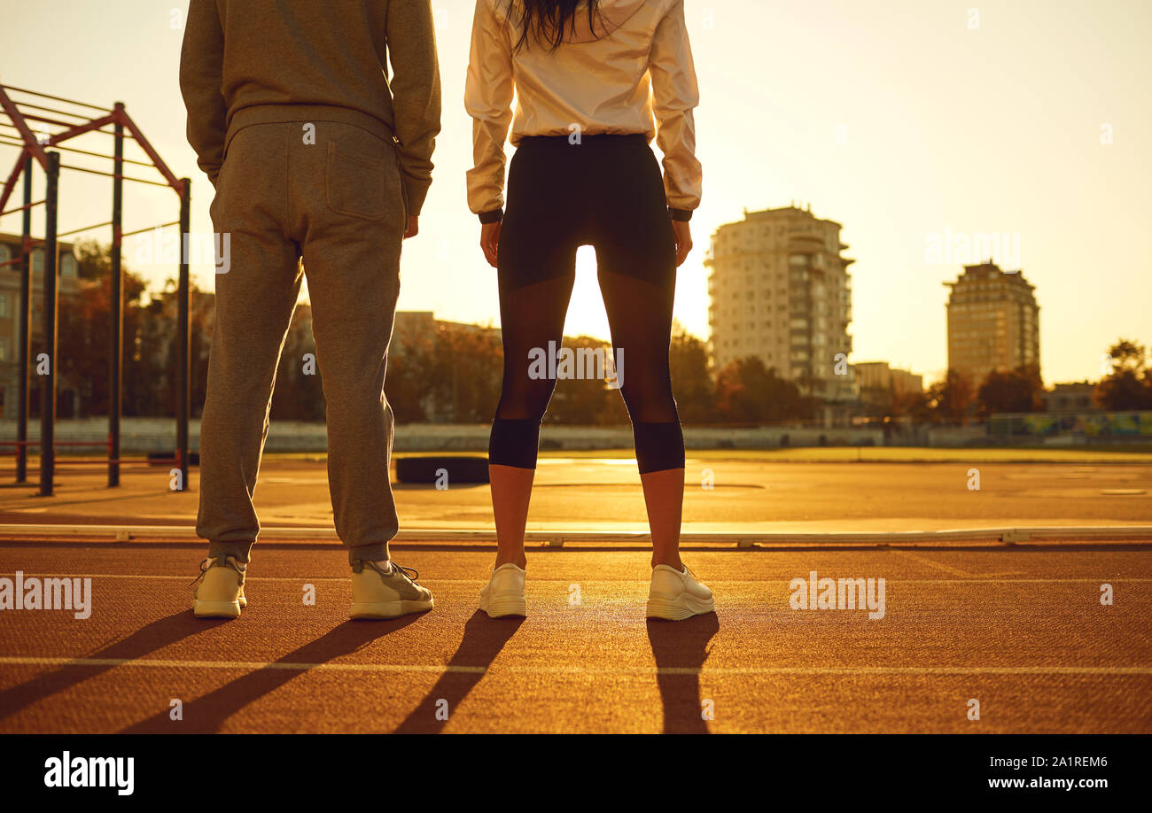 Athletic couple in the morning at the stadium Stock Photo - Alamy