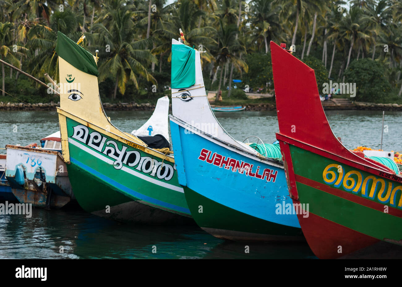 Traditional Fishing boats moored at a small fishing harbour in ...