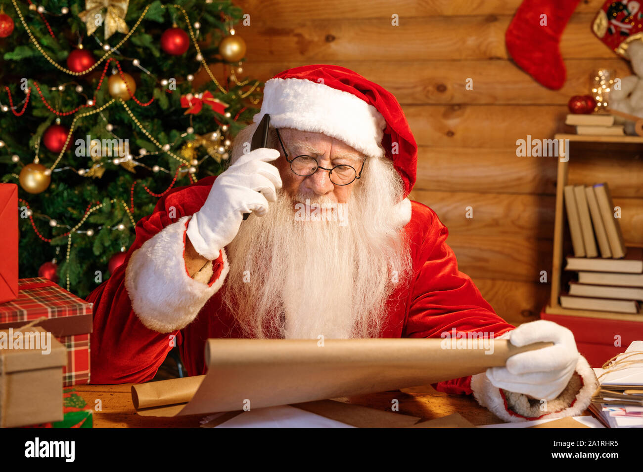 Mobile Santa with cellphone calling parents before Christmas while ...