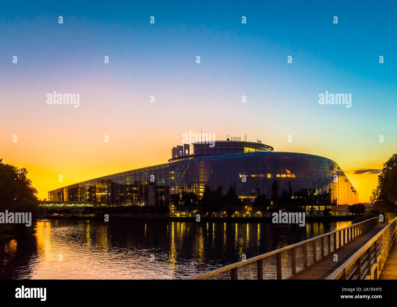 Twilight view of the eastern glass facade of the Louise Weiss building ...