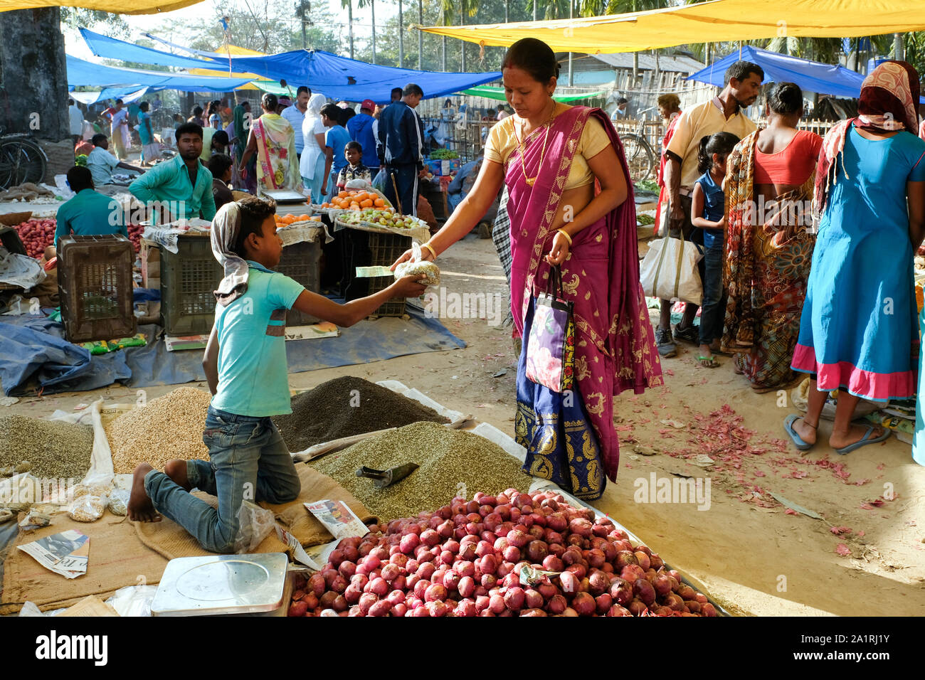 Farmers and sellers with their products on the stalls on market day in ...