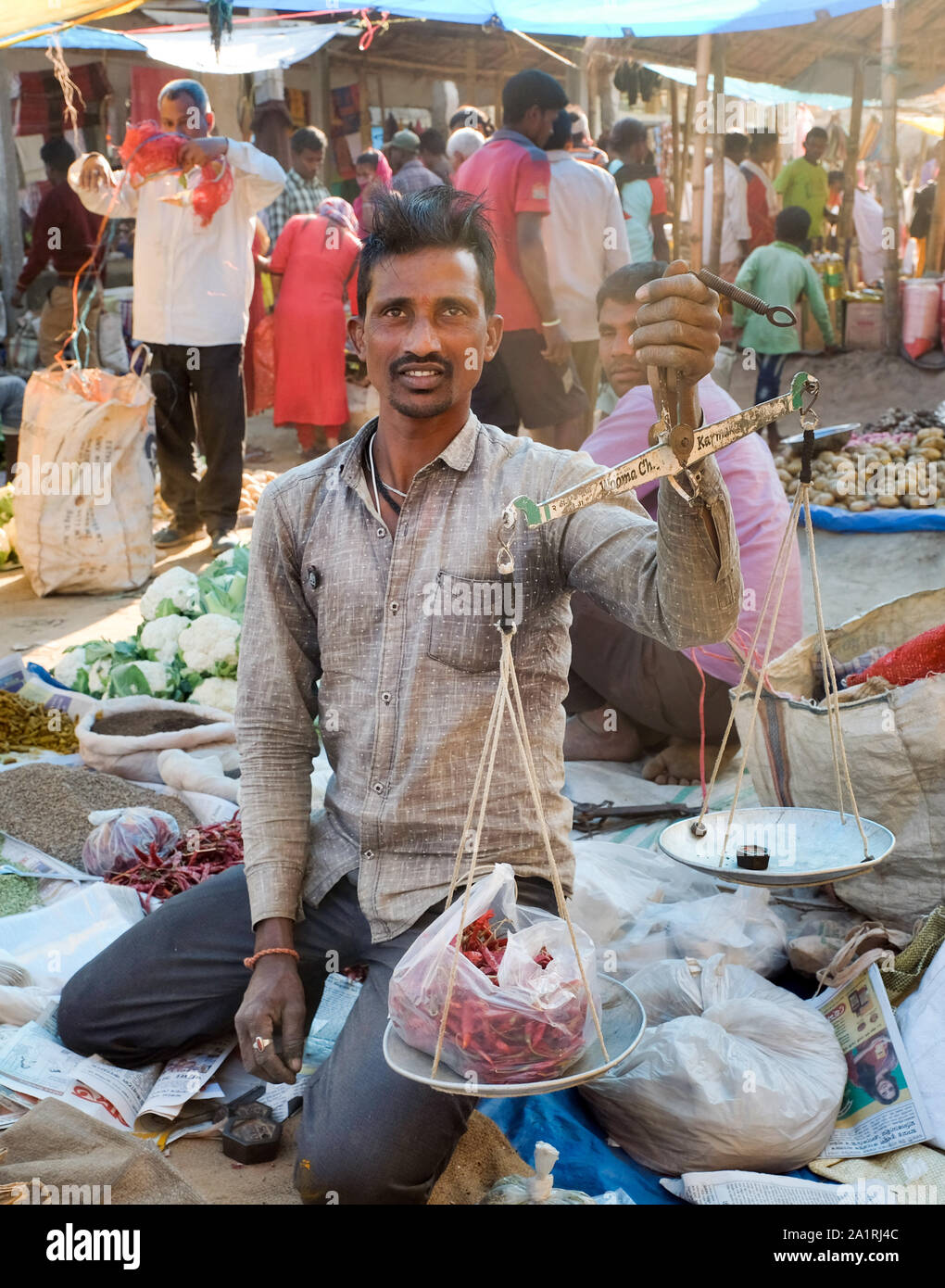 Farmers and sellers with their products on the stalls on market day in ...