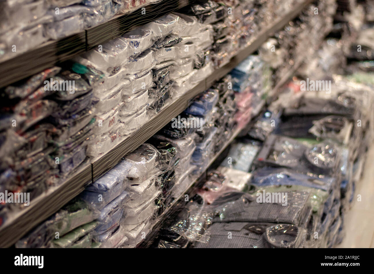 Shirts on a shelf hi-res stock photography and images - Alamy