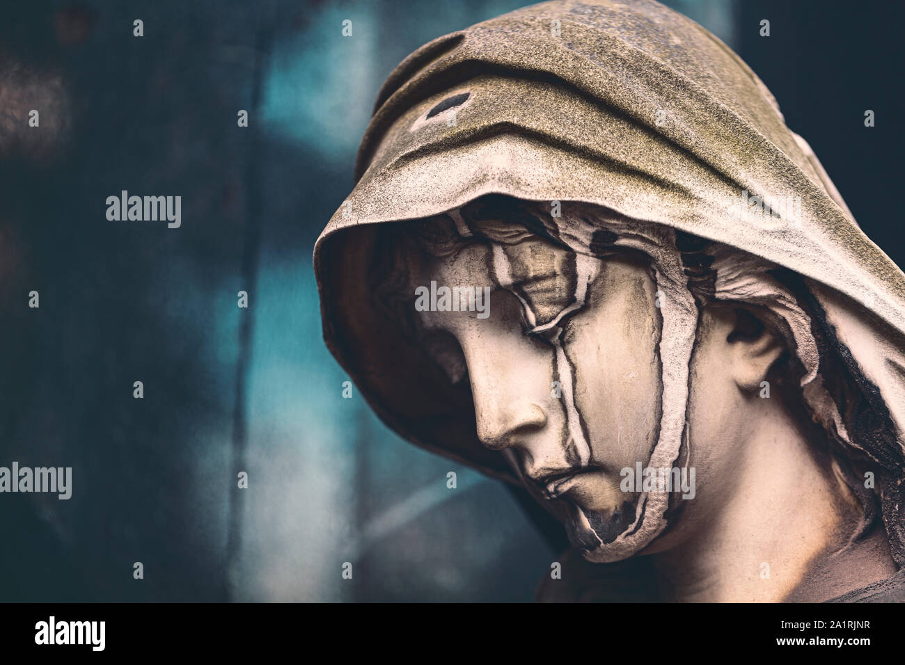 close up of an old sculpture of a sad woman Stock Photo - Alamy