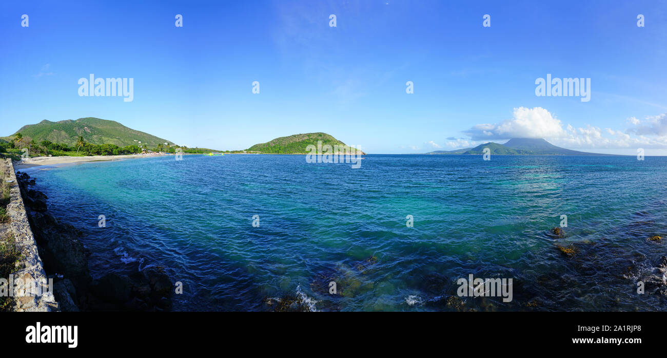 Day view of the Nevis Peak volcano across the water from St Kitts Stock ...